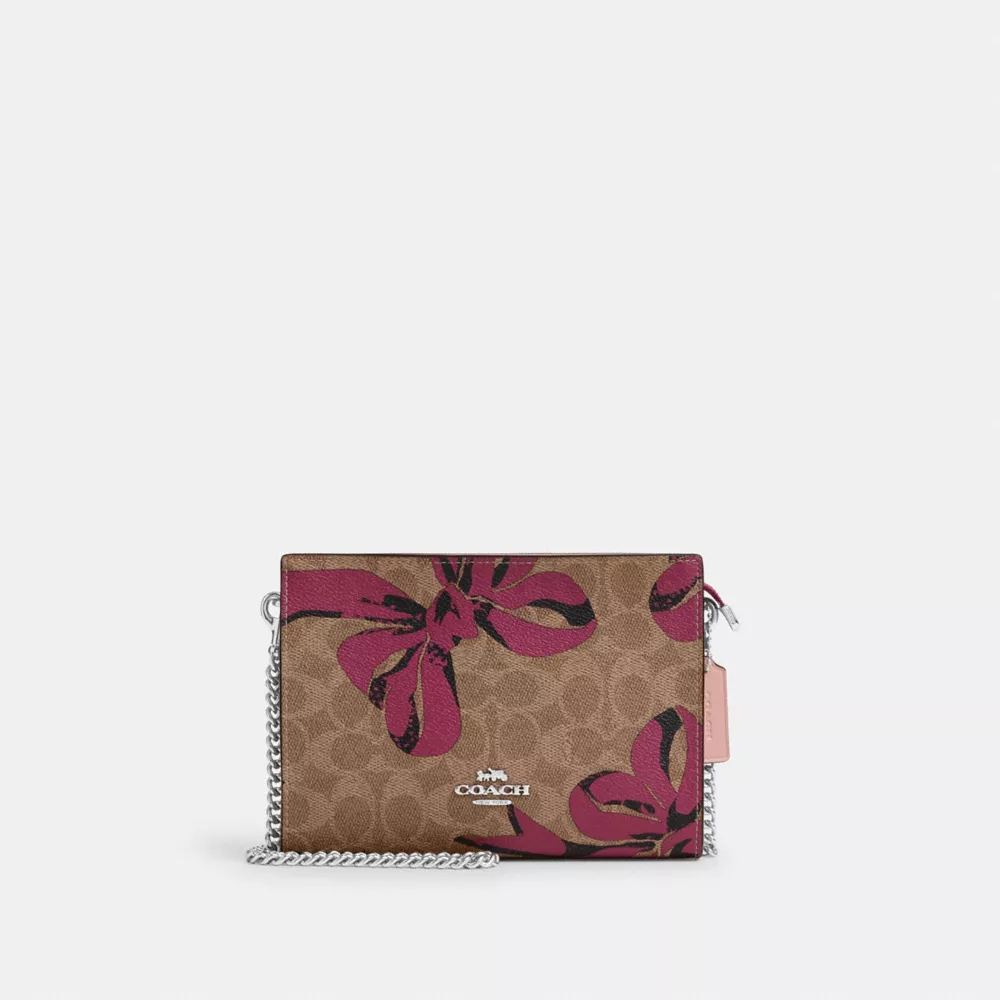 Coach: The Slim Crossbody Bag In Signature Canvas With Bow Print Is ...